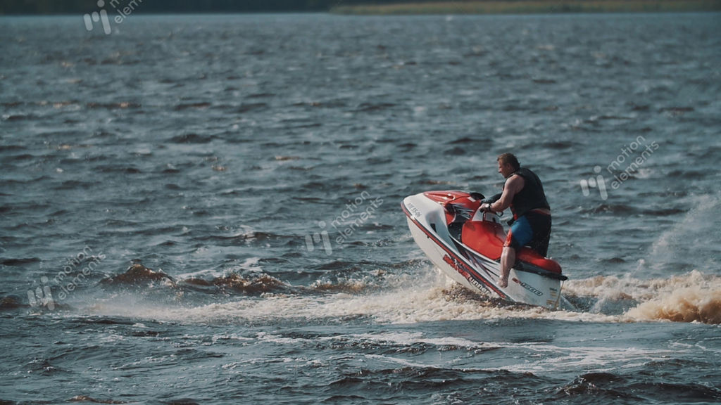 Fat Man In Life Vest Riding Jet Ski On Lake Water, Making Turns And ...