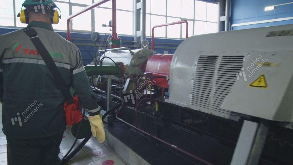 Worker Walks Around Modern Operating Compressor Stock video footage ...