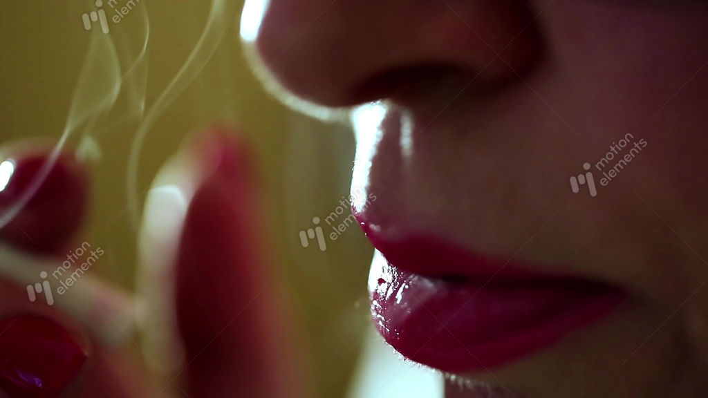 Smoking Woman With Red Nails And Red Lips Exhales Through The Nose And ...